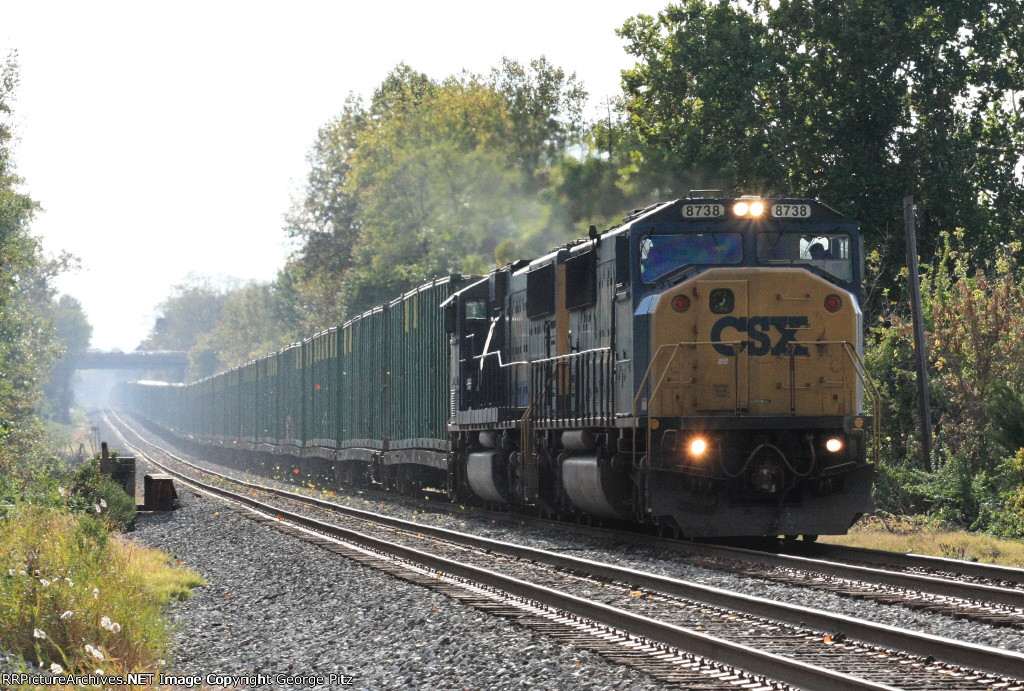 CSX 8738 and train Q702